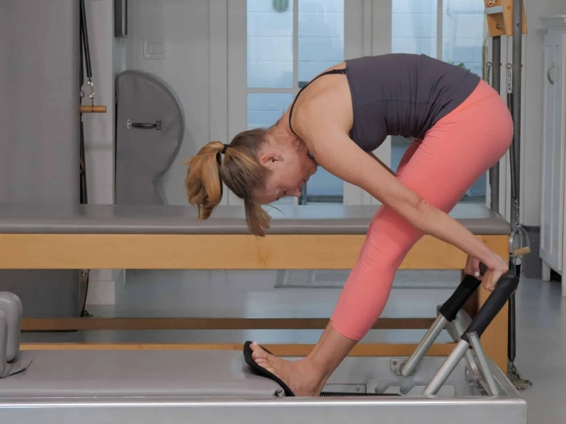 Pilates Tendon Stretch on the Reformer: Benefits, Technique, and Key ...